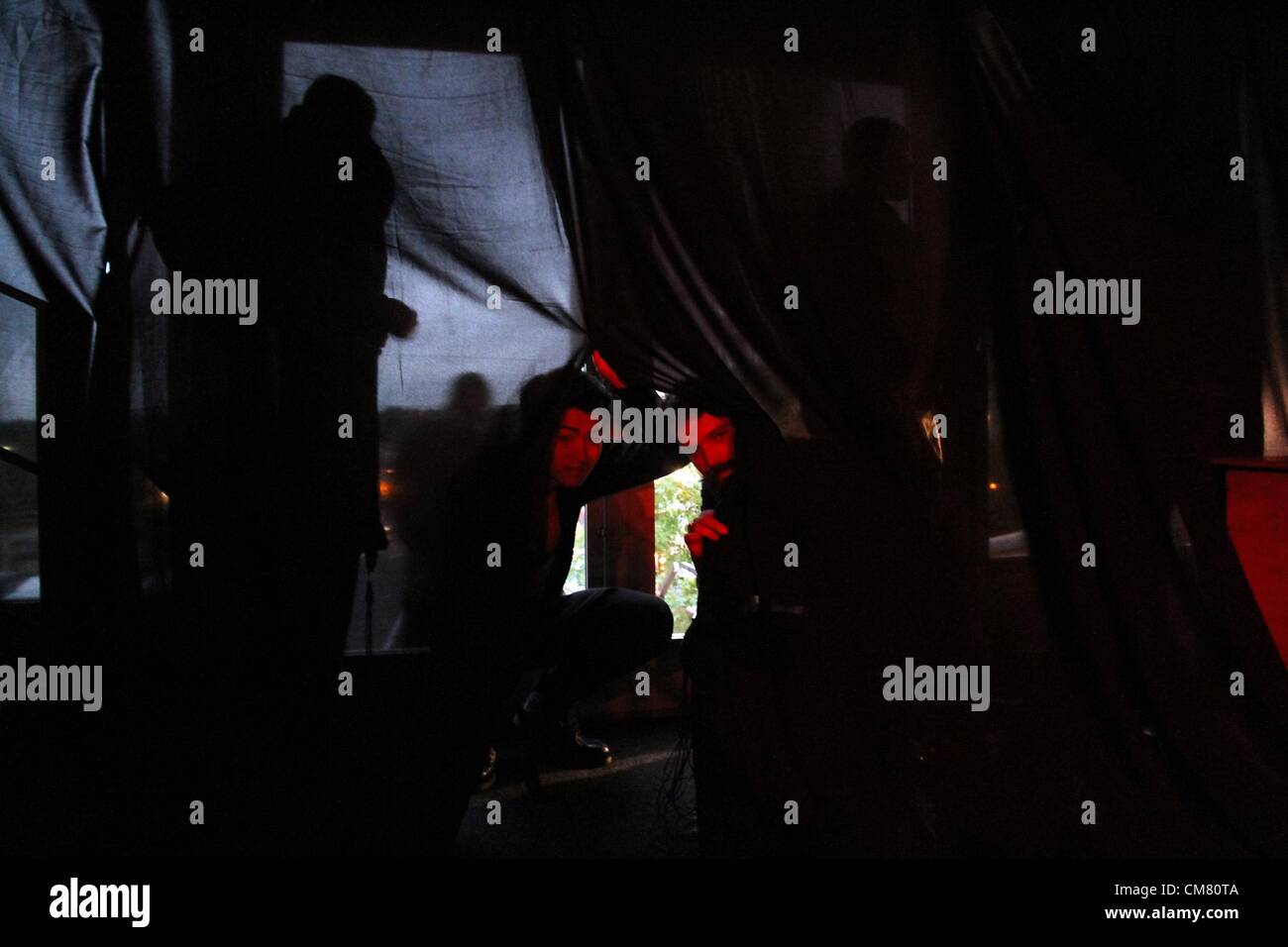 JOHANNESBURG, SOUTH AFRICA – OCTOBER 24: Models back stage during the ...