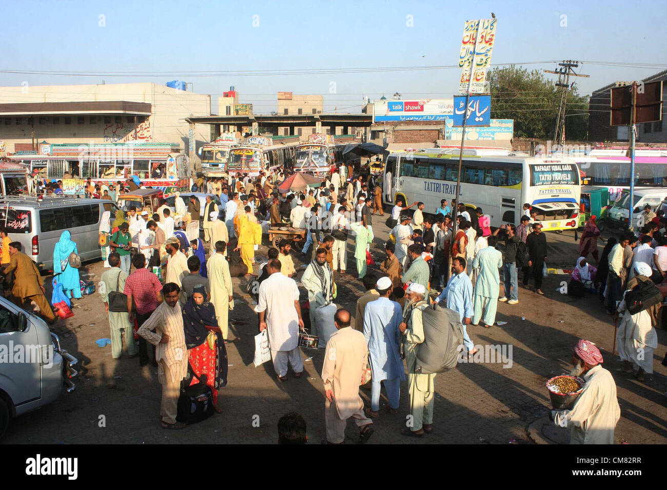 people gather at Lari Adda to board on passenger bus as they are going ...