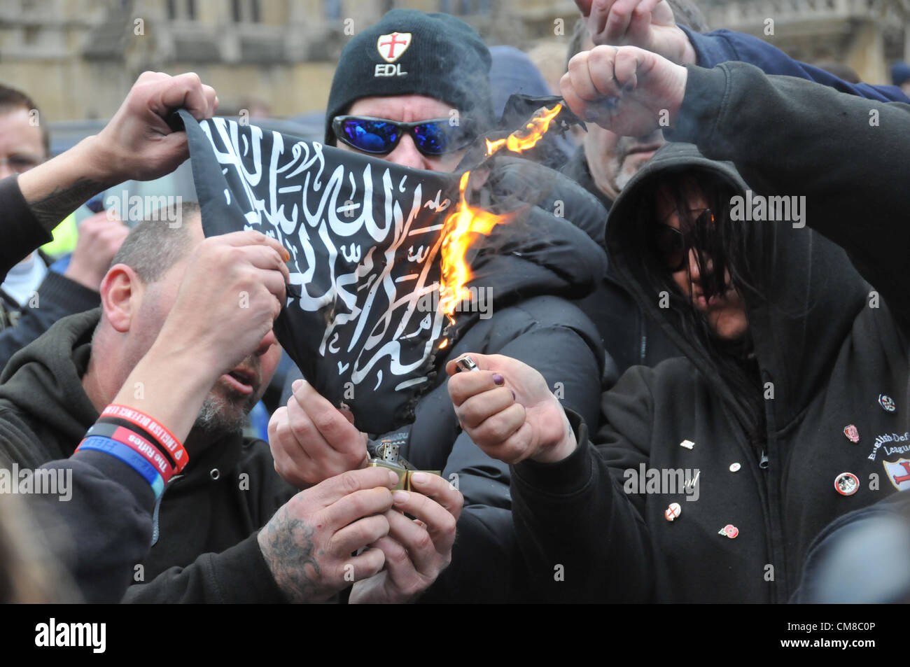 Westminster, London, UK. 27th October 2012. EDL members set fire to an ...