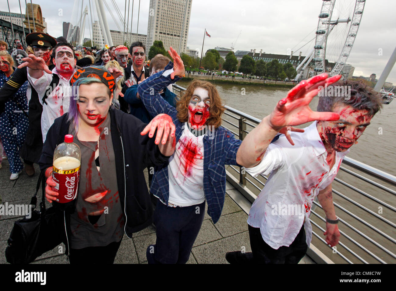 London, UK. 27th October 2012. People dressed up as zombies celebrating ...