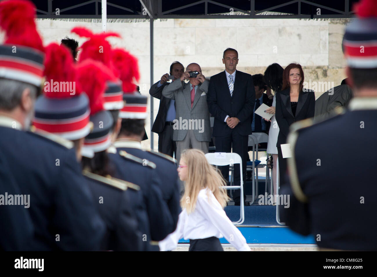 Dignitary photographing parade Stock Photo - Alamy