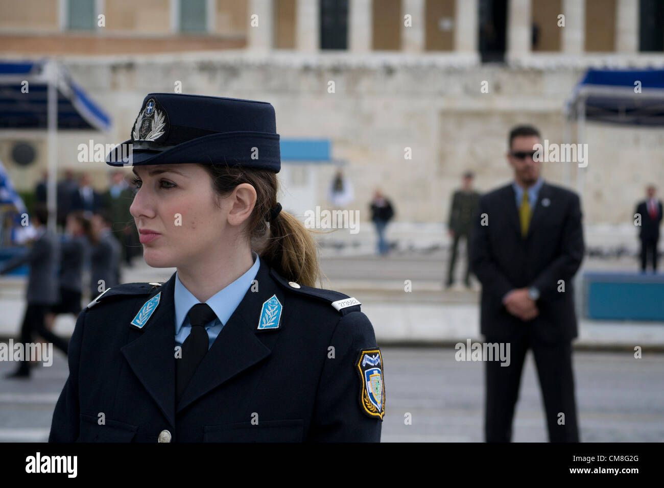 Close-up of young female police officer securing parade Stock Photo - Alamy