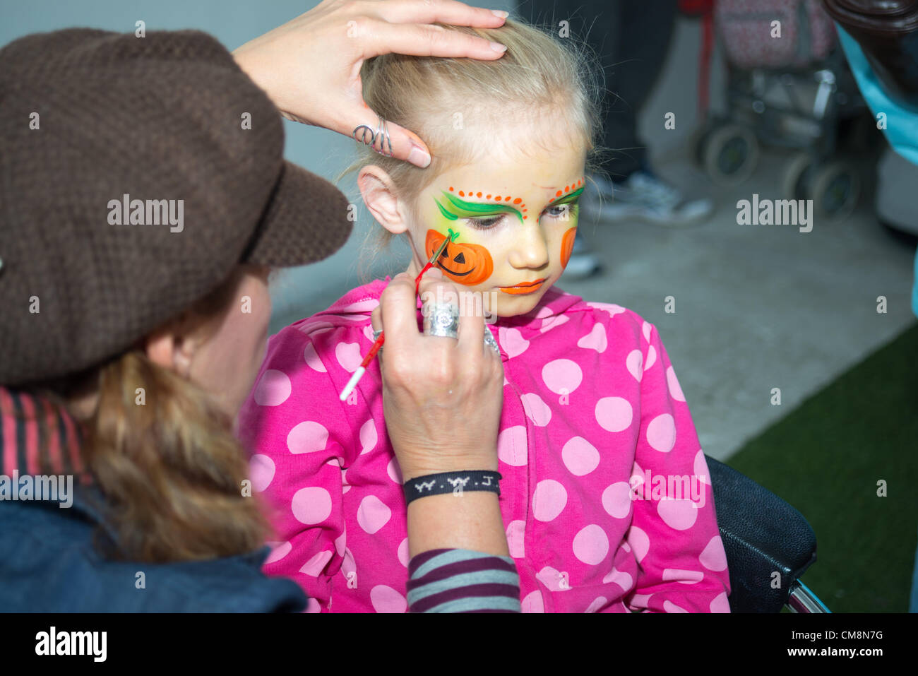Young girls having Halloween-themed face painting, St Austell, Cornwall ...