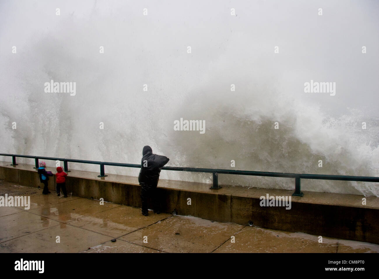 A large wave generated by Hurricane Sandy slams into a seawall. Lynn ...