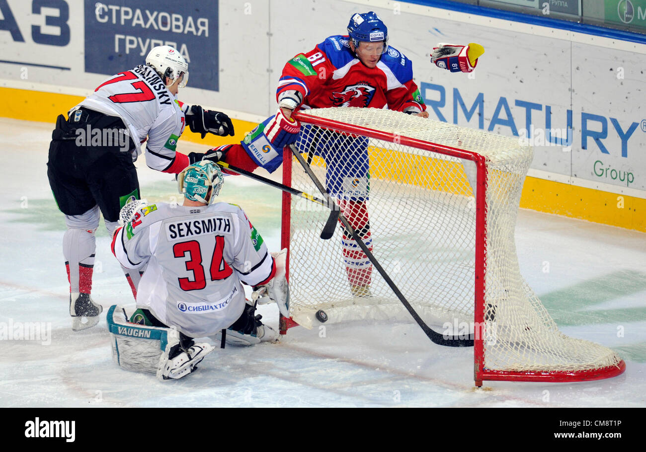 Marcel Hossa of Lev Praha, right, goalkeeper Tyson Sexsmith, center ...
