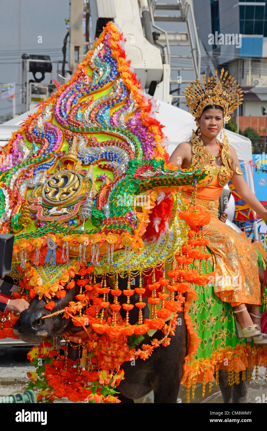 A Thai beauty poses on a water buffalo beauty champion in Chonburi ...