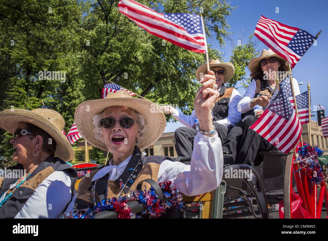 June 30, 2012 - Prescott, Arizona, U.S - Women wave American flags at ...