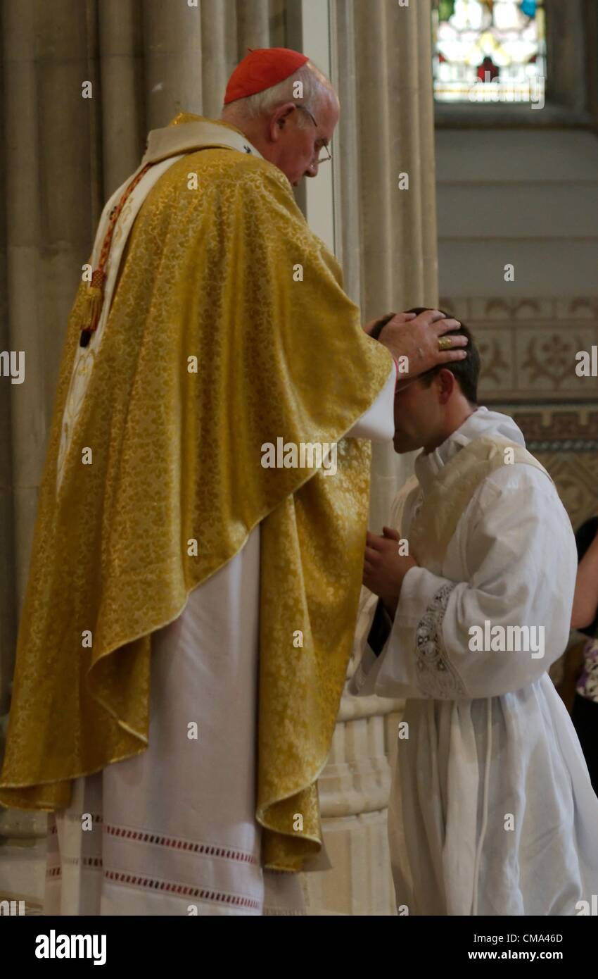 THE Laying on of Hands. Cardinal Sean Brady lays his hands on Thomas ...