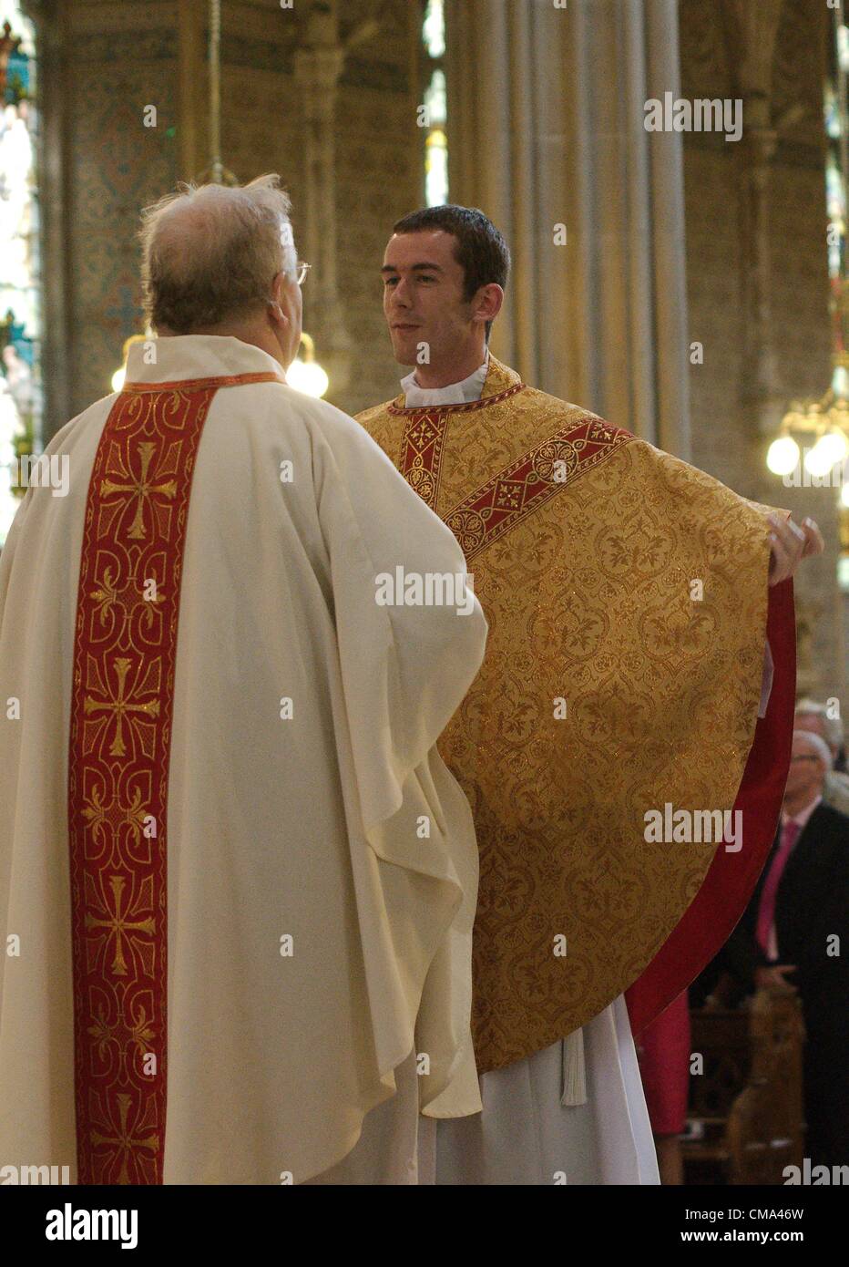 Newly ordained Fr. Thomas McHugh is dressed in his priestly robes ...