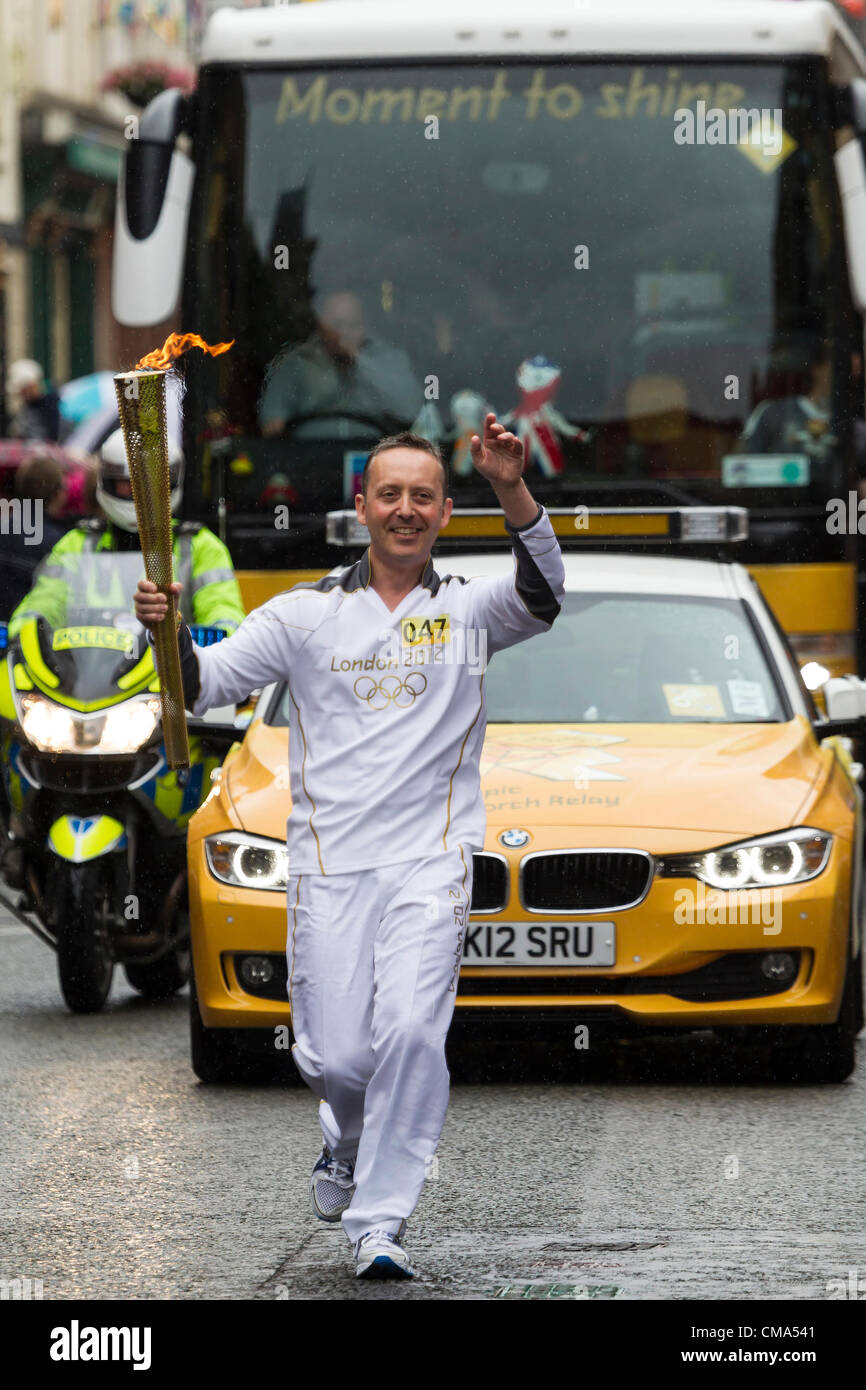 Northampton UK. 2nd July 2012. Andy Wightman carries The Olympic torch ...
