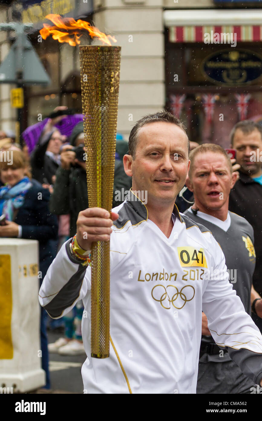 Northampton UK. 2nd July 2012. Andy Wightman carries The Olympic torch ...