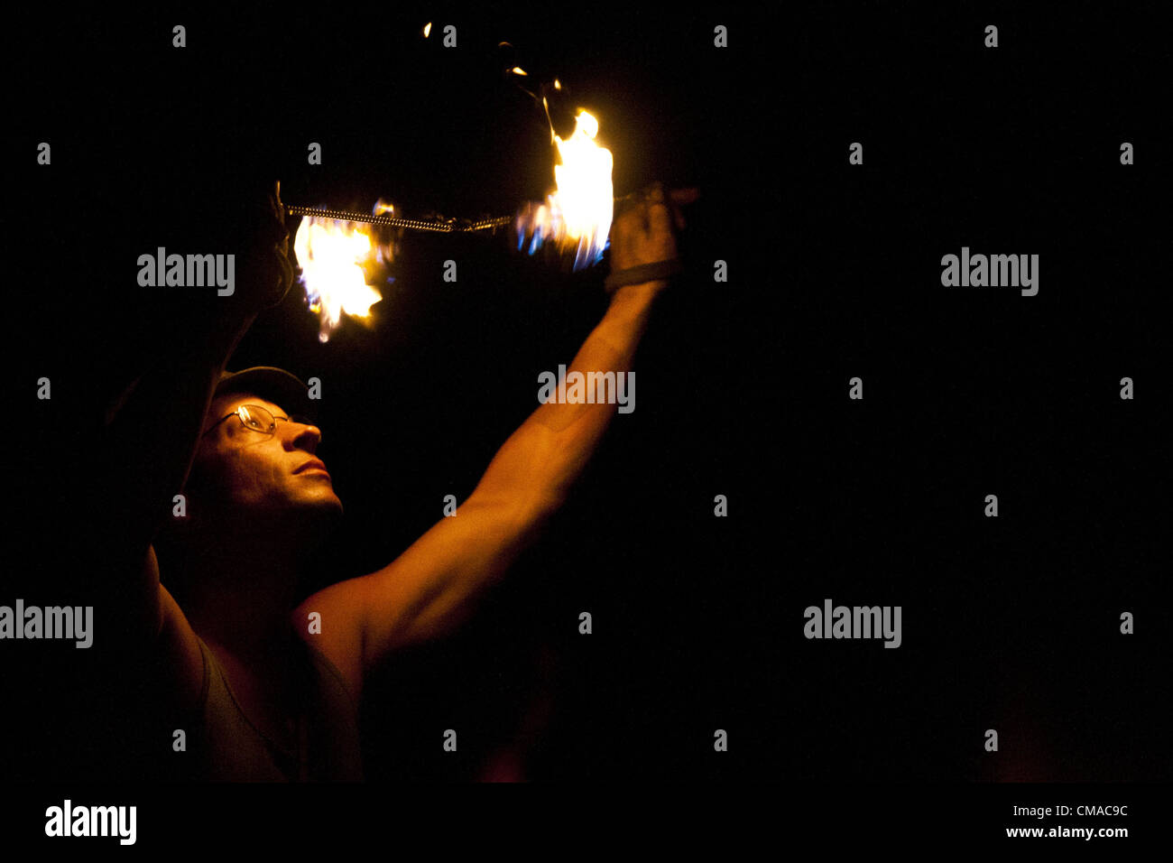 July 3, 2012 - Aliso Viejo, California, U.S - A fire twirler performs ...