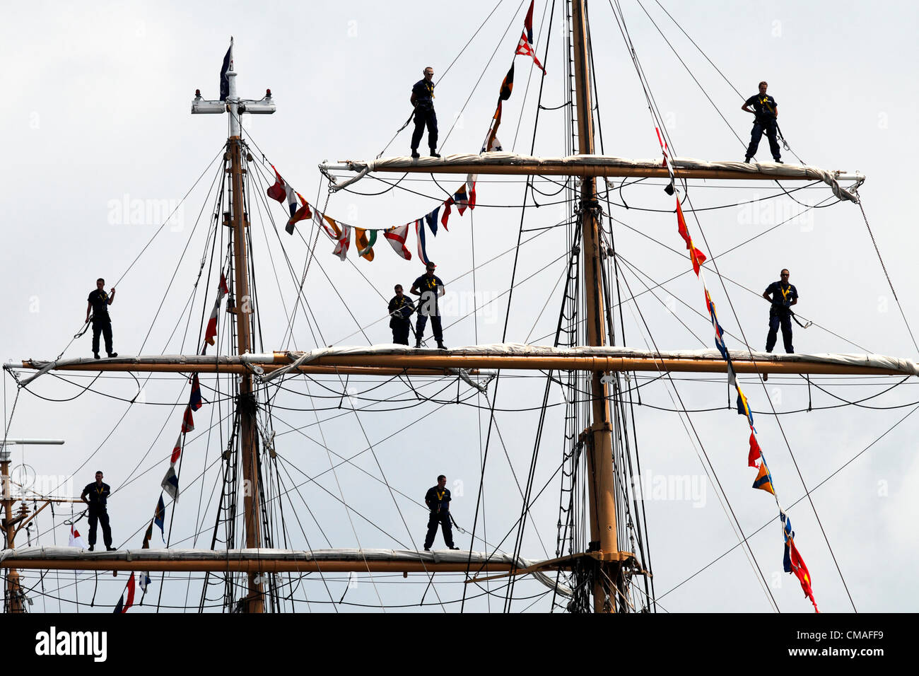 Seamen stand in the rigging of the U.S. Coast Guard tall ship Eagle ...