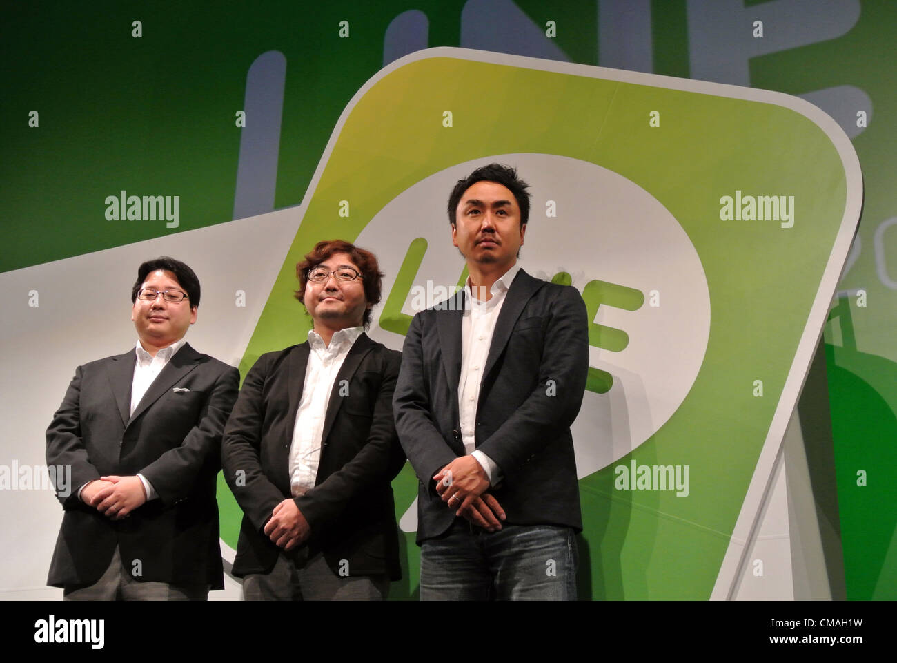 President Akira Morikawa of NHN Japan, center, attends at media ...