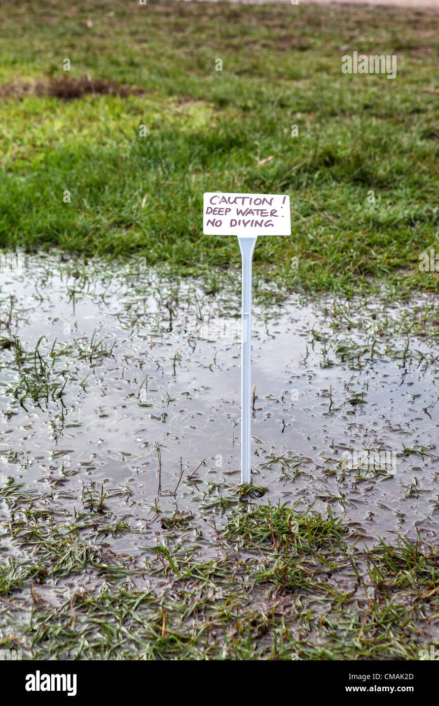 Sign humour puddle mud amusing funny hi-res stock photography and ...