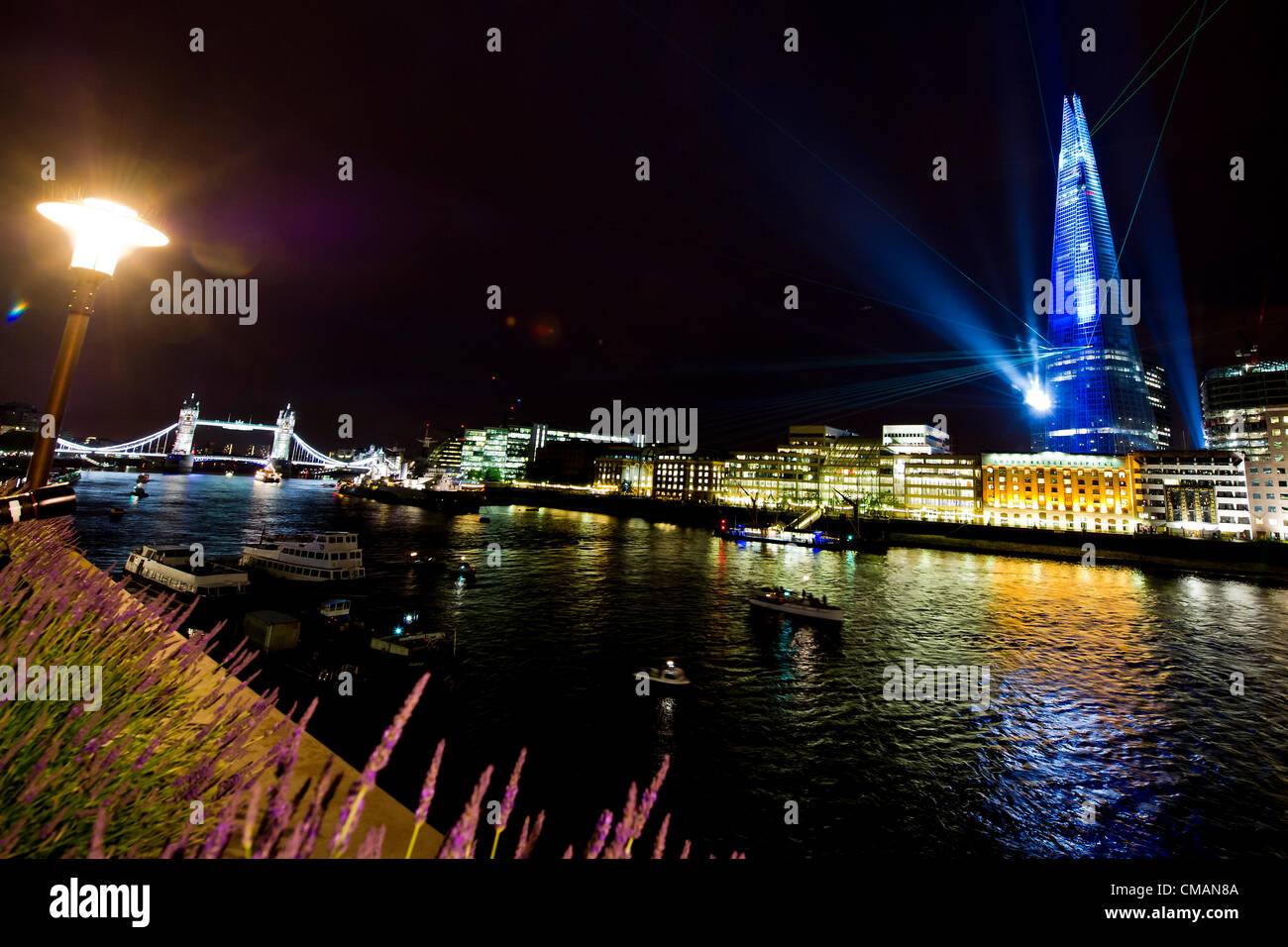 The Shard is illuminated with lasers and lights to mark its completion ...