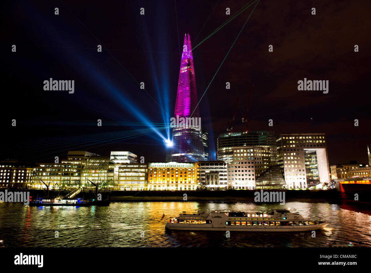 The Shard is illuminated with lasers and lights to mark its completion ...