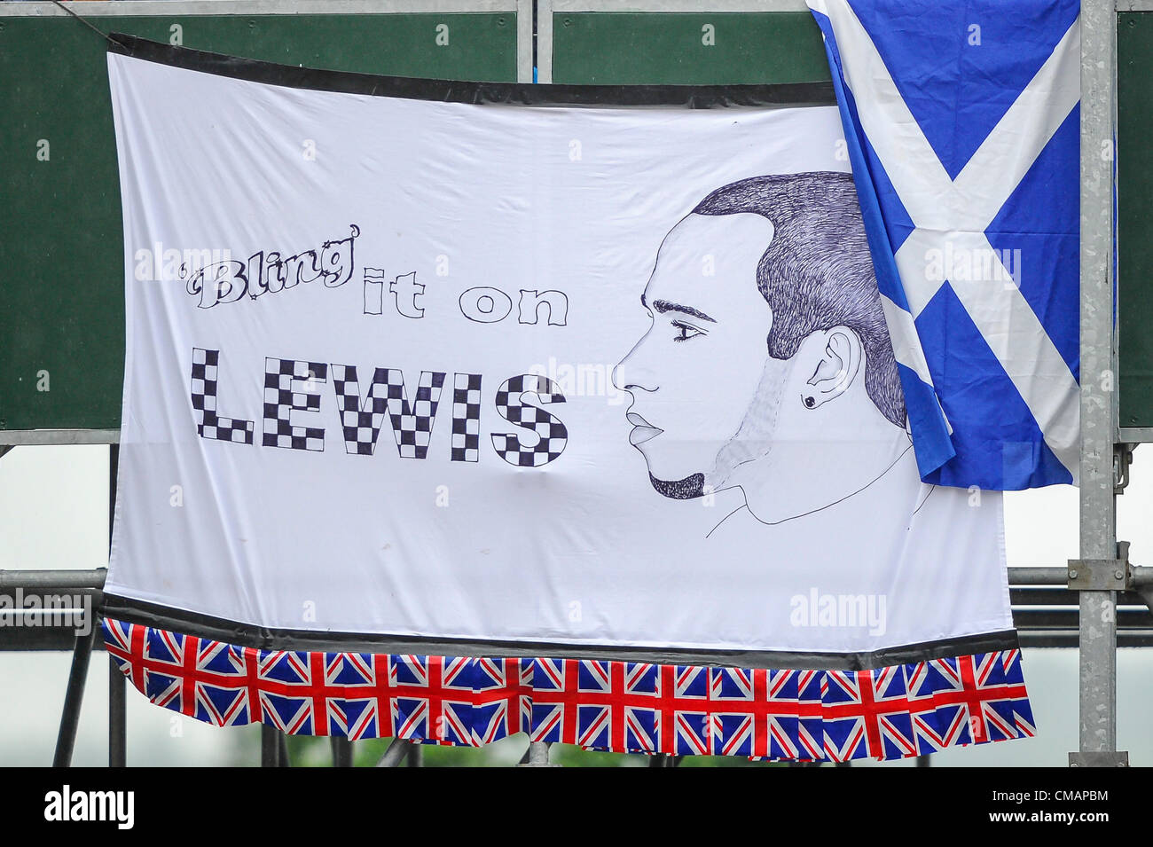 06.07.2012 Towcester, England. Supporters show banners for Lewis ...