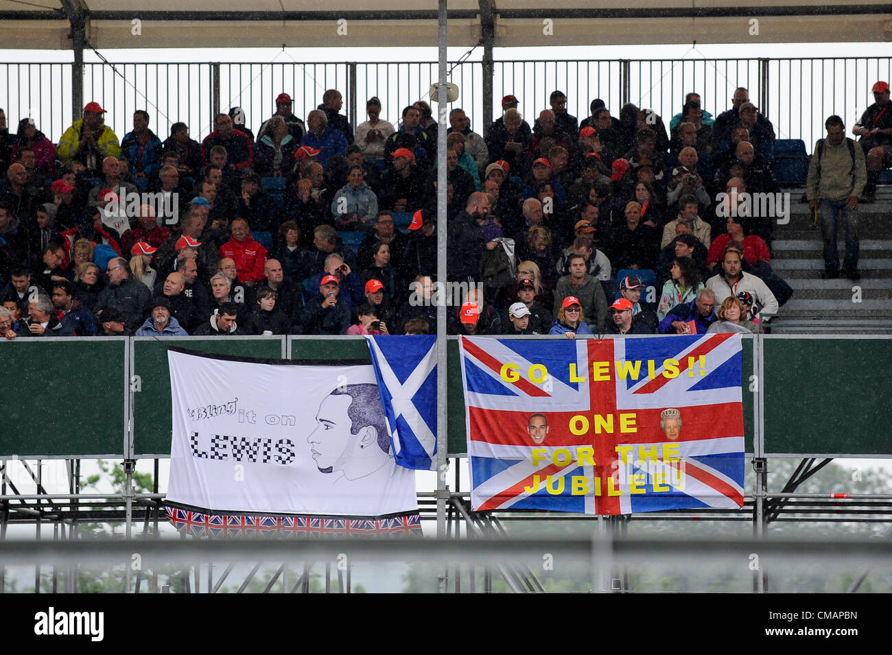 06.07.2012 Towcester, England. Supporters show banners for Lewis ...