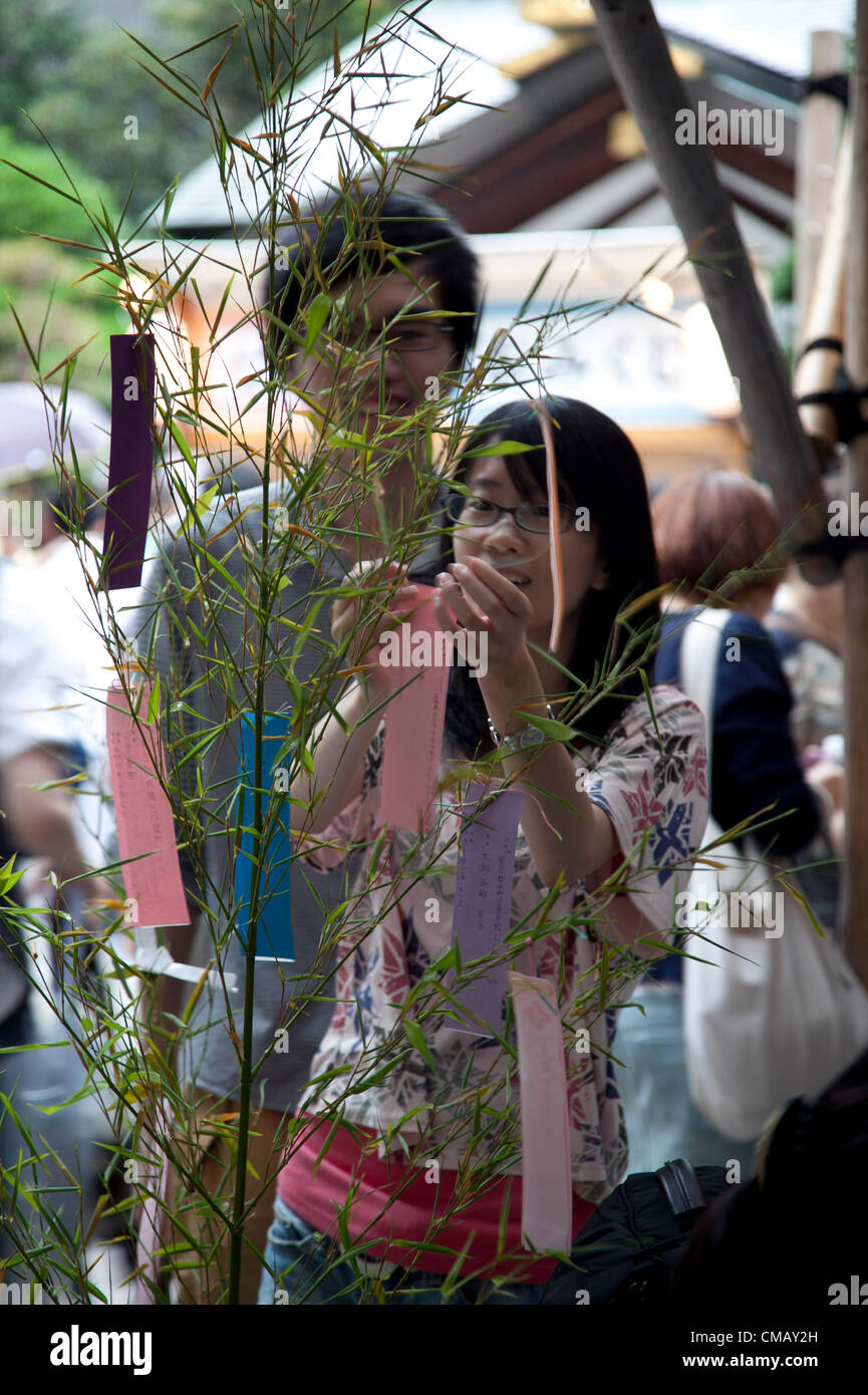 July 7, 2012, Tokyo, Japan – Tokyo Daijingu Shrine. Visitors write ...