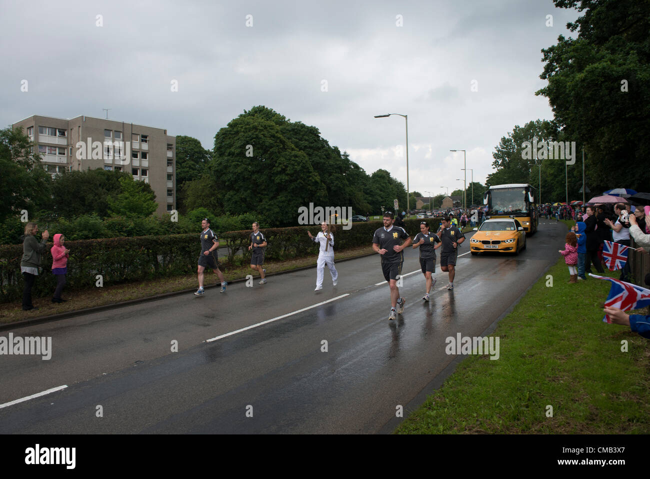 8 July 2012. Rachel Gower, 12, carries the olympic torch in St. Albans ...