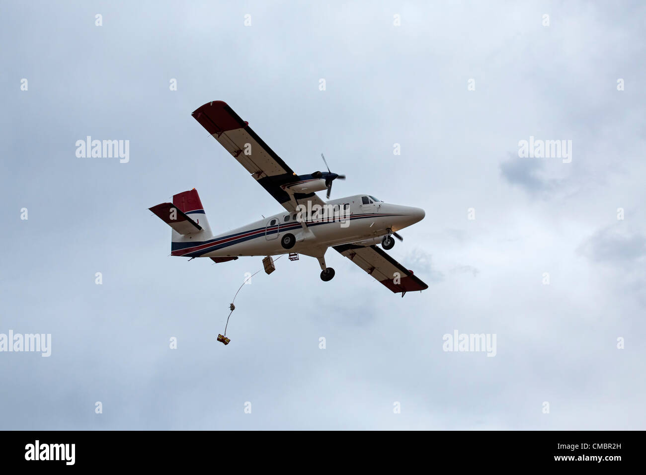 Firemen Smoke Jumpers parachute into wildfire forest fire area to start ...