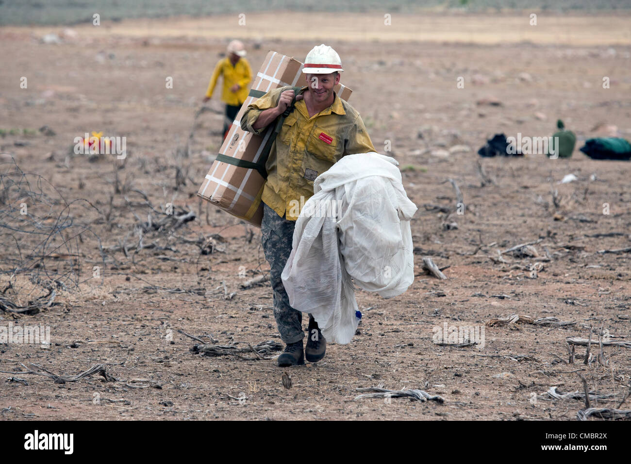 Firemen Smoke Jumpers parachute into wildfire forest fire area to start ...