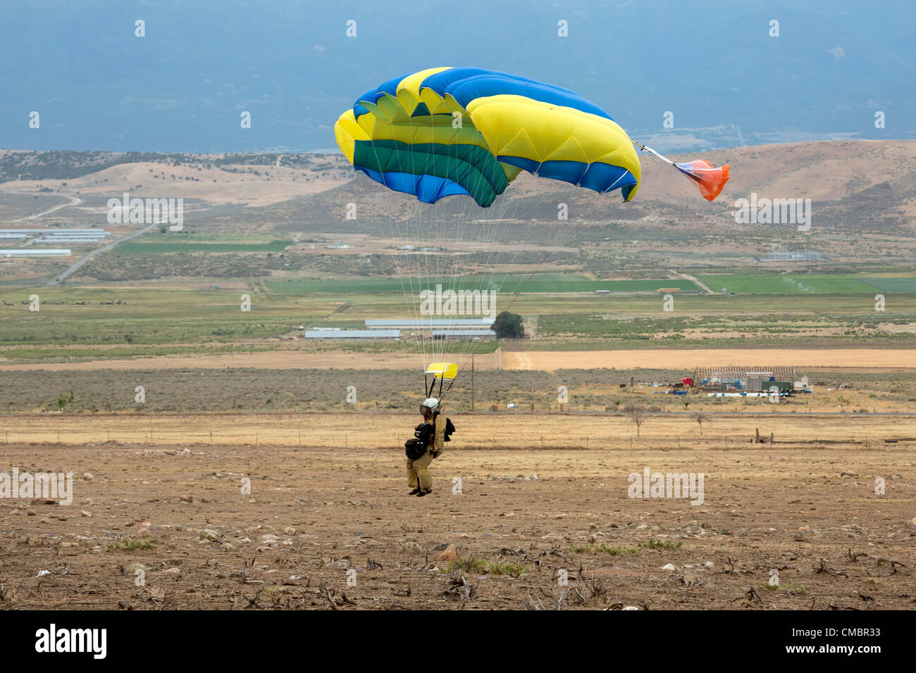 Firemen Smoke Jumpers parachute into wildfire forest fire area to start ...