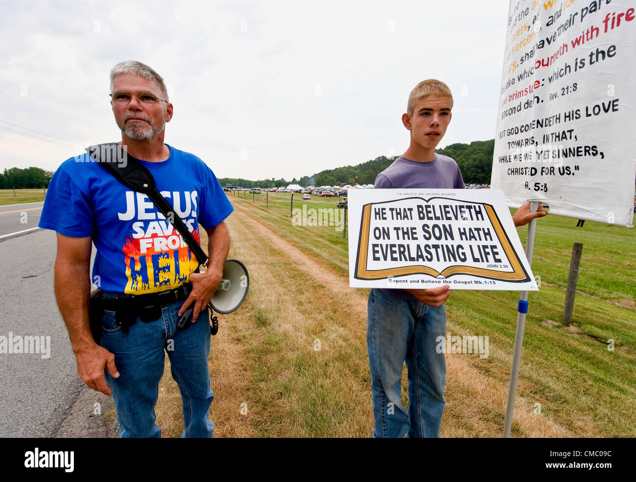 July 13, 2012 - Palmyra NY, USA - Anti-Mormon protesters hold signs ...
