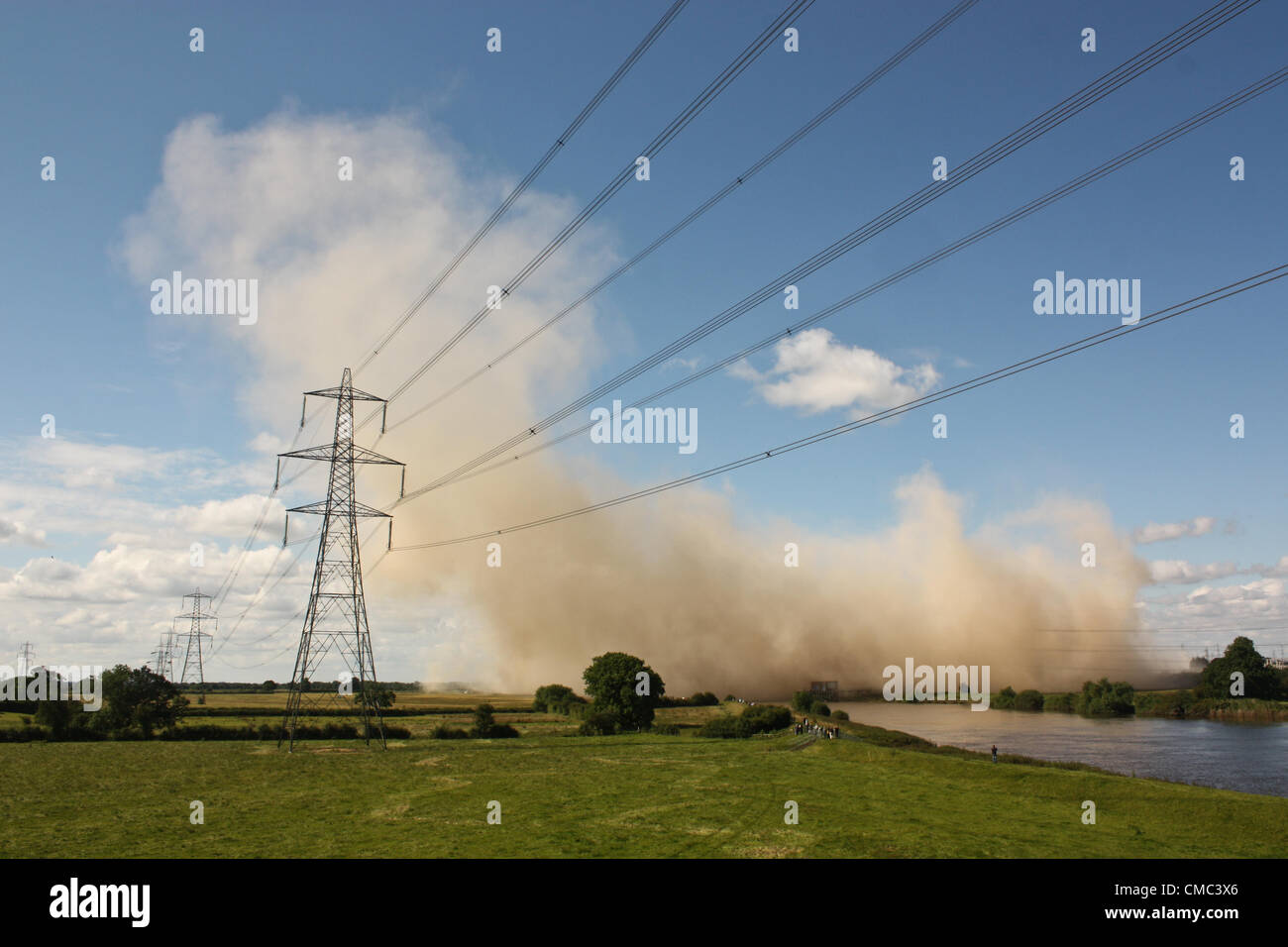 A plume of dust heads east from the demolition of the powerstations ...