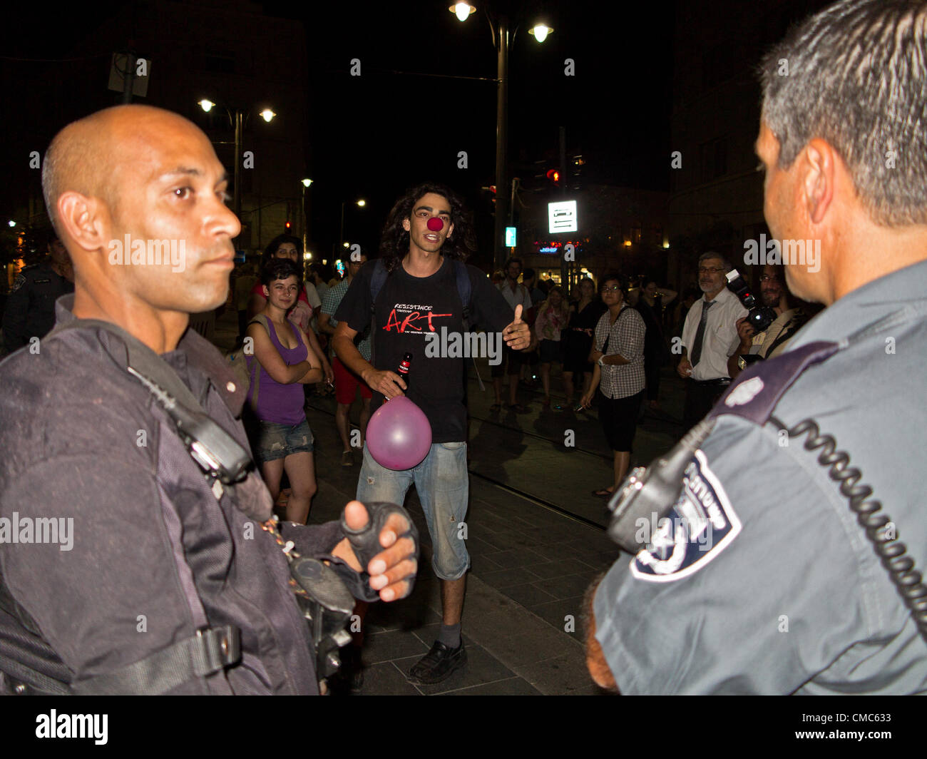 Man in clown costume tells policemen “You work for the public. I am the ...