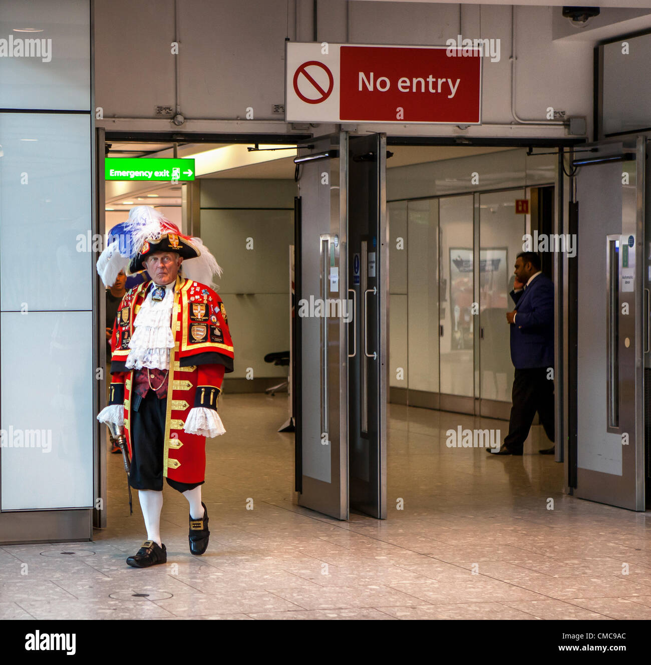 Heathrow Airport, London, UK 16th July 2012: A Town crier welcomes ...
