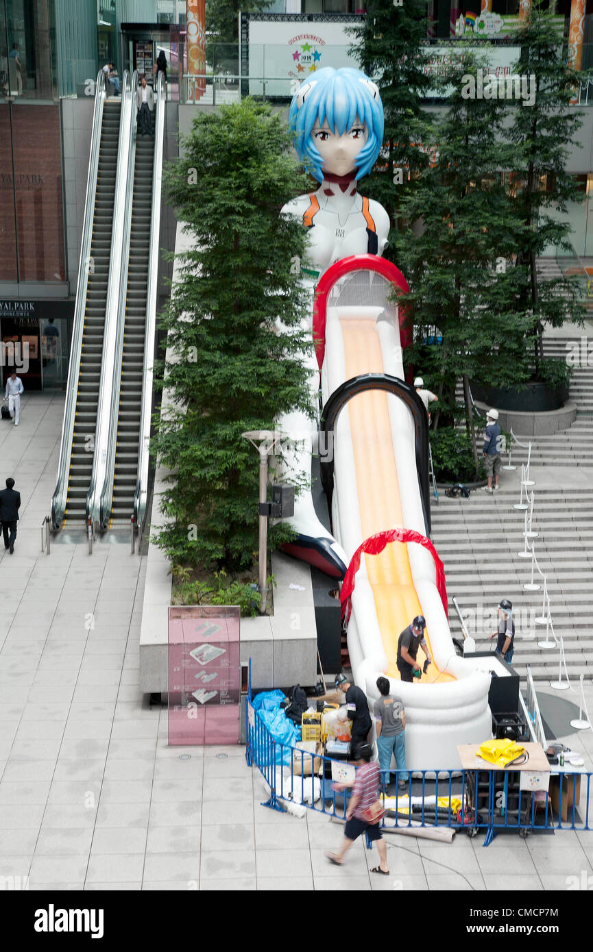 July 20 2012, Tokyo, Japan - Staffs install an inflatable slide in ...