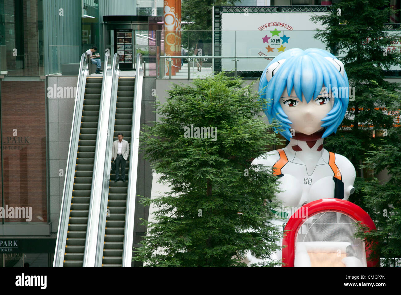 July 20 2012, Tokyo, Japan - A passenger on the down the escalators ...