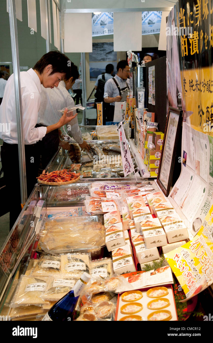 July 20 2012, Tokyo, Japan - A visitor takes a packet of food in the ...