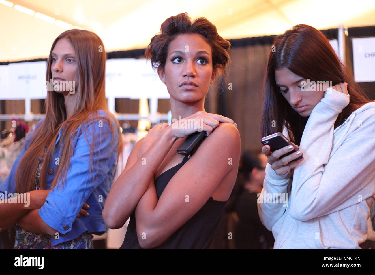 July 20, 2012 - Miami Beach, Florida, U.S. - Models prepare backstage ...