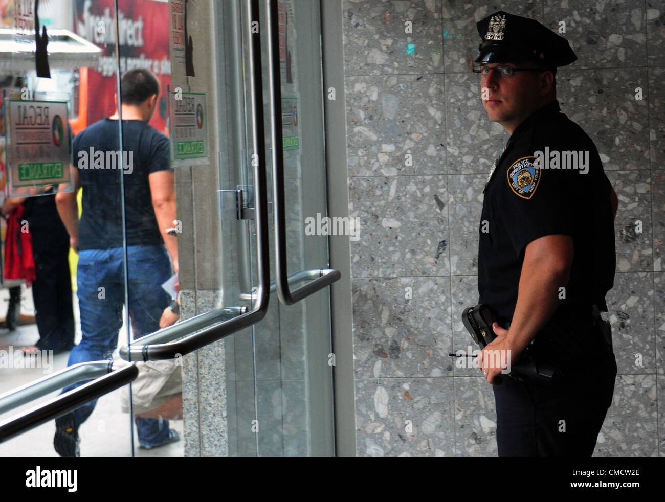 July 20, 2012 - Manhattan, New York, U.S. - Police officers stand watch ...