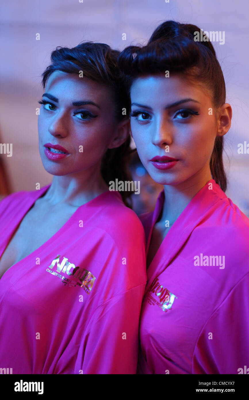 July 20, 2012 - Miami Beach, Florida, U.S. - Models prepare backstage ...