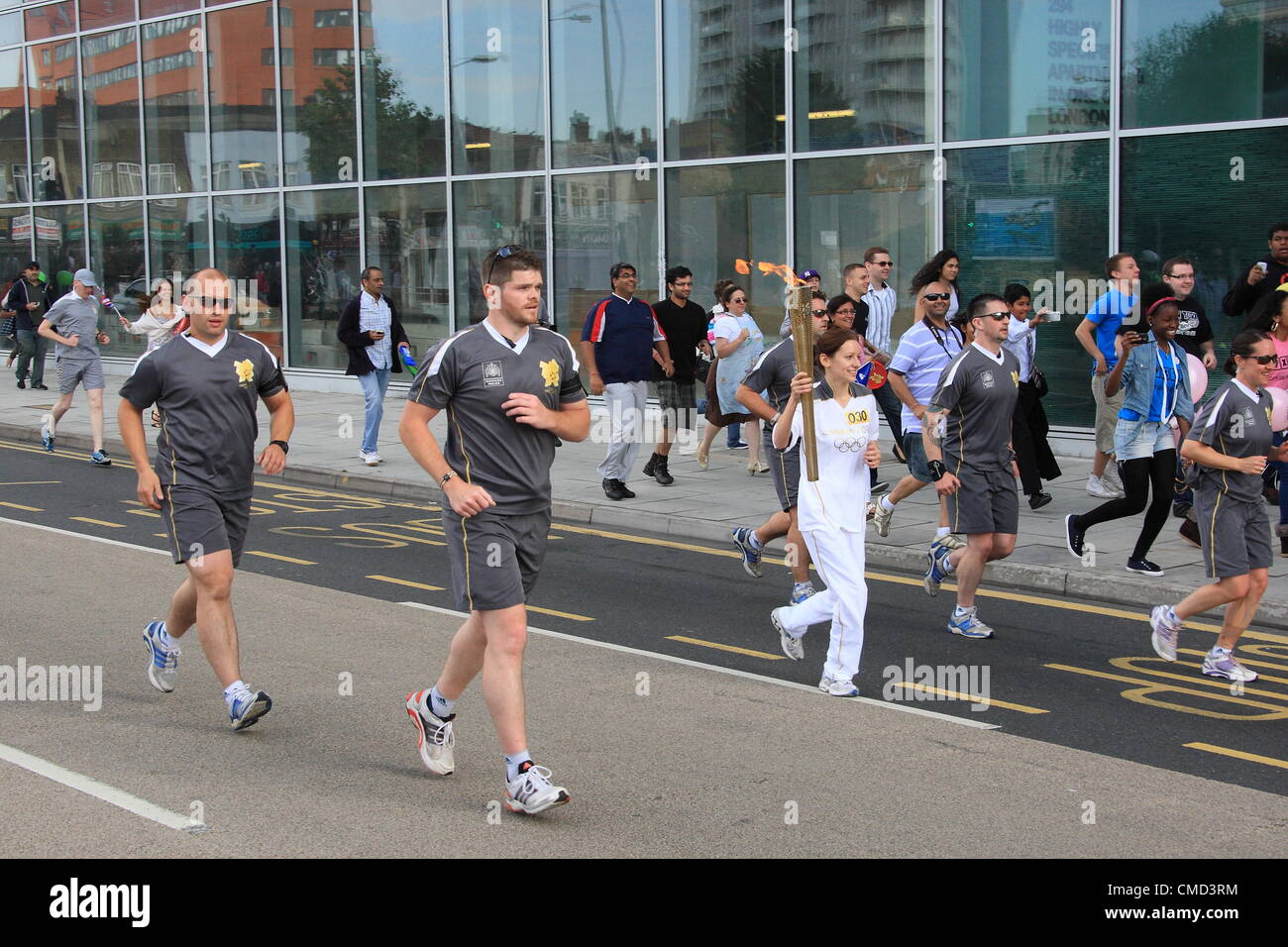 Ilford, UK. 22nd July 2012. Torch relay arrives in Redbridge. Hundreds ...