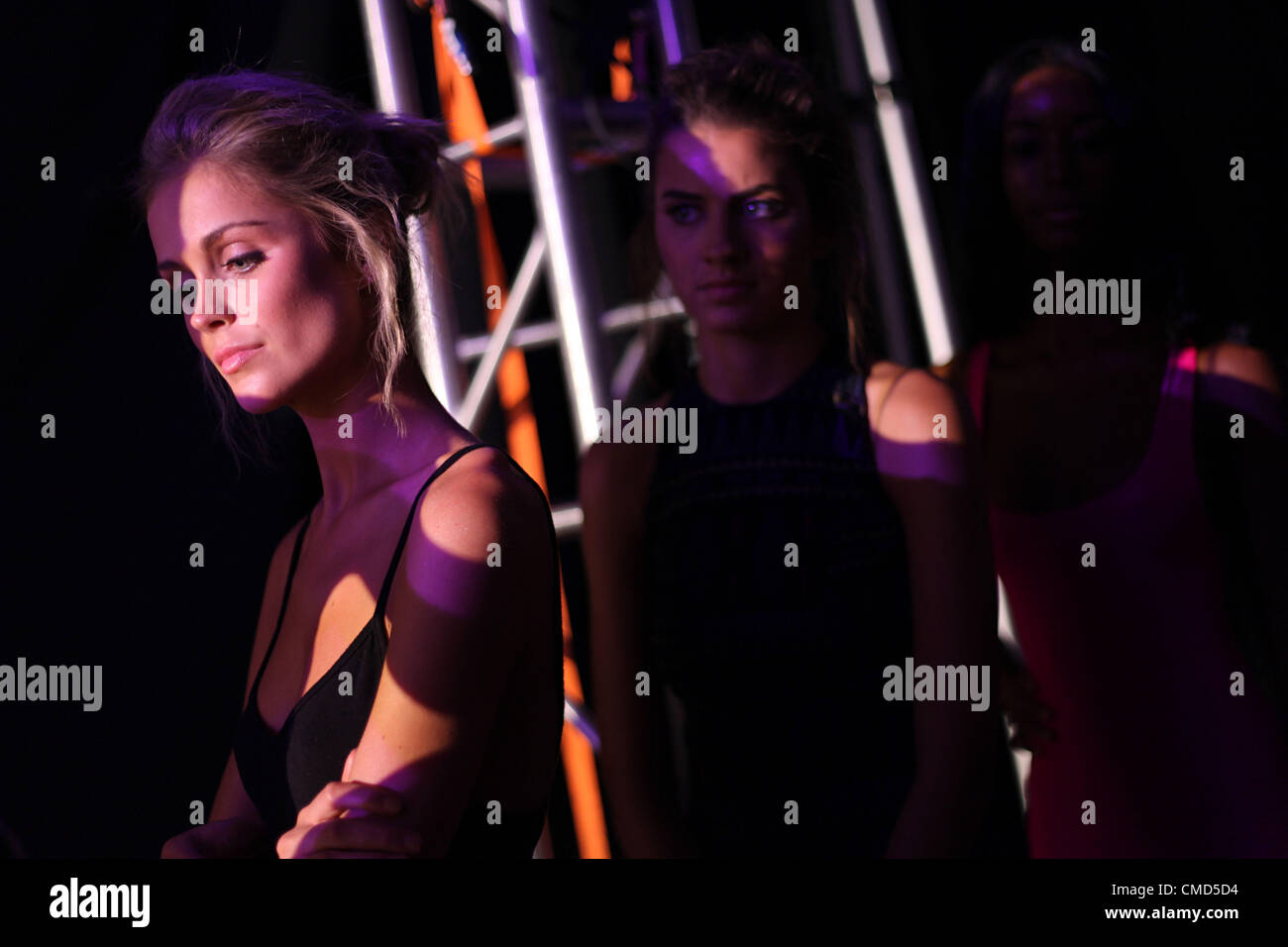 July 21, 2012 - Miami Beach, Florida, U.S. - Models wait backstage at ...