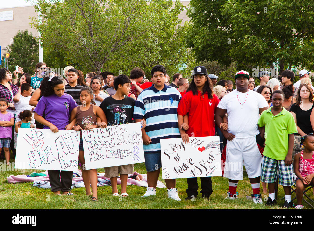 Aurora, CO – Friends of AJ Boik gather to mourn his death at the Aurora ...