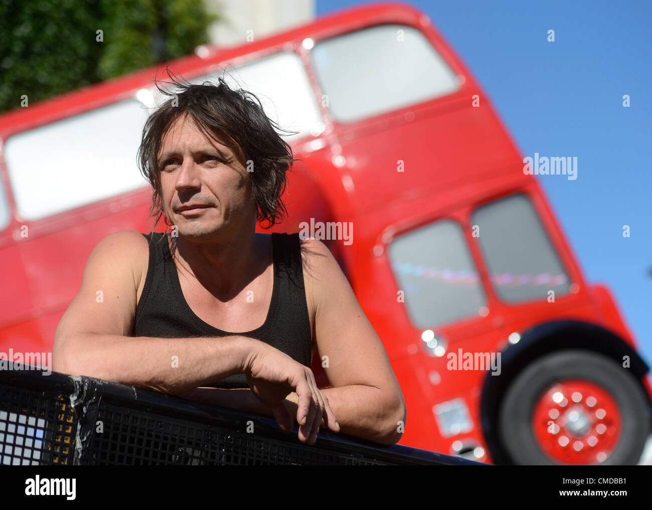 Czech artist David Cerny poses with a British double-decker bus turned ...