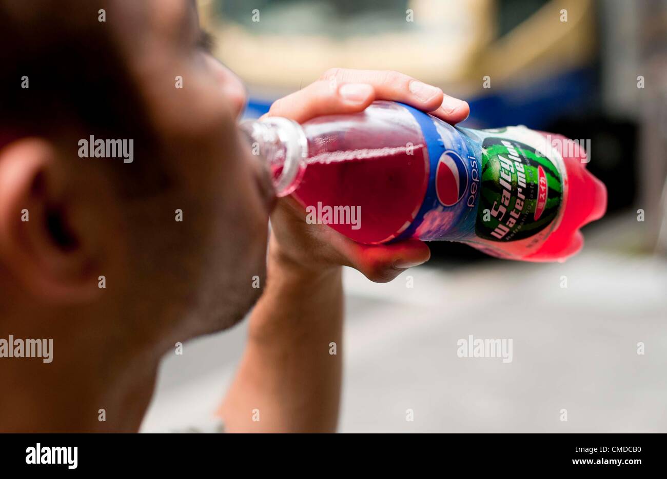 July 24, 2012, Tokyo, Japan – A man tries Pepsi Salty Watermelon. Pepsi ...