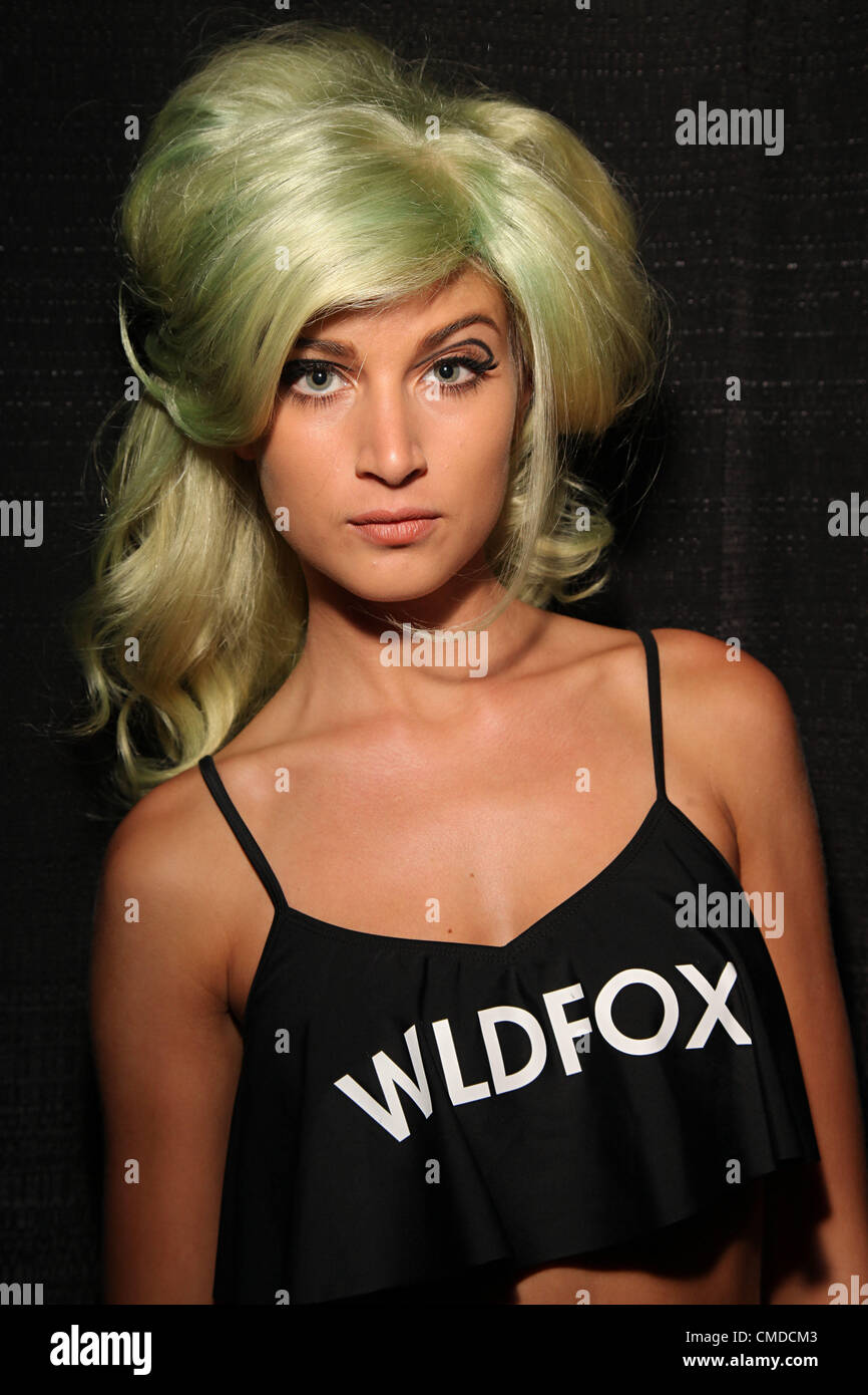 July 23, 2012 - Miami Beach, Florida, U.S. - A model poses backstage at ...
