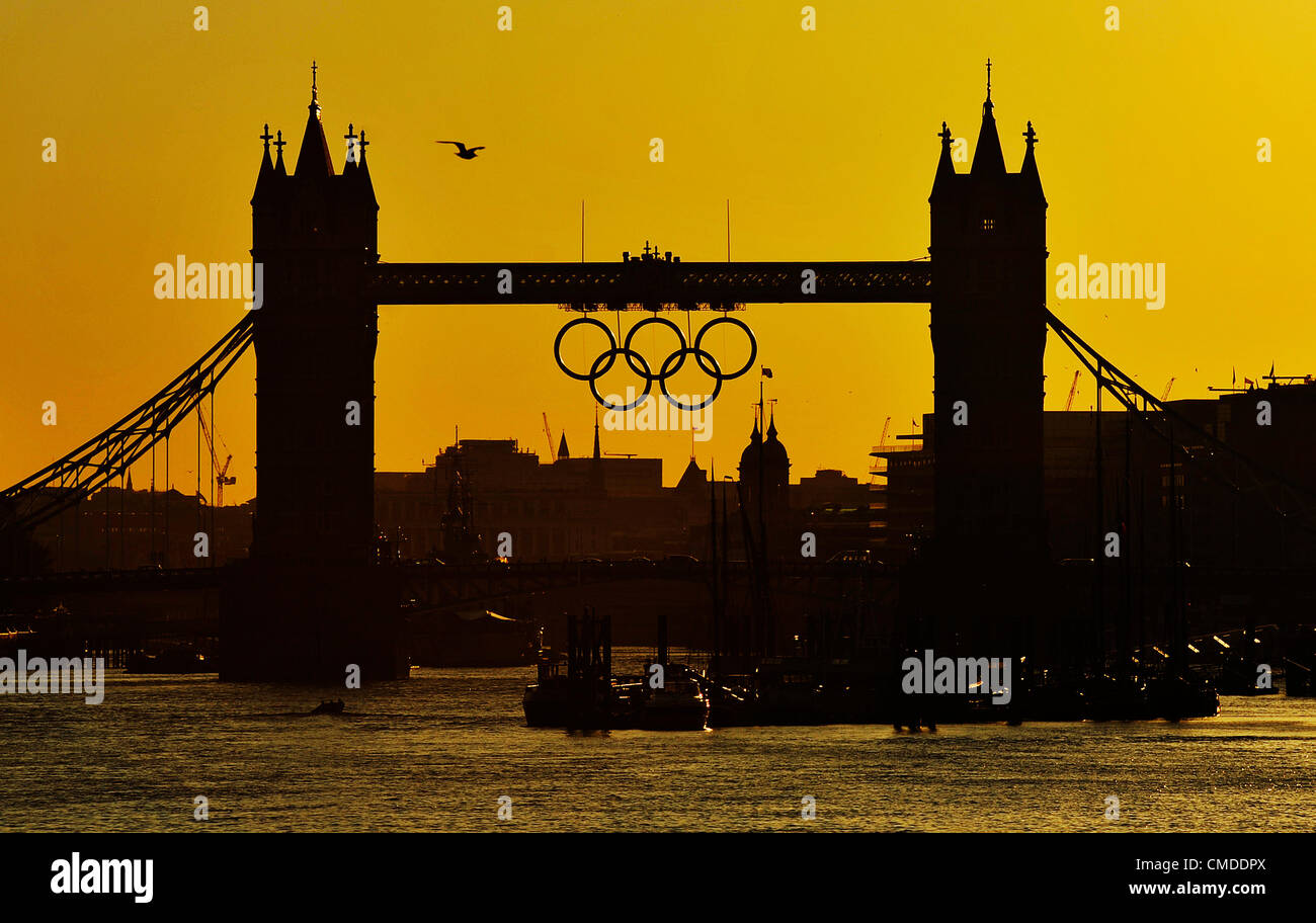 Sunset over London showing Tower bridge & the Olympic rings. July 23 ...