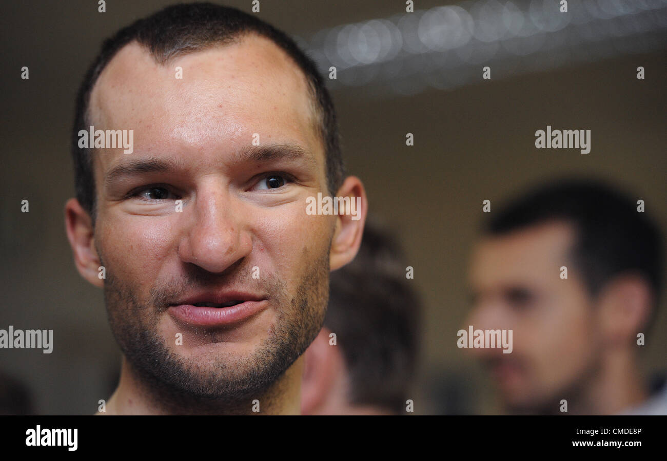 Cyclist Jan Barta poses before the plane with Czech sportsmen for the ...