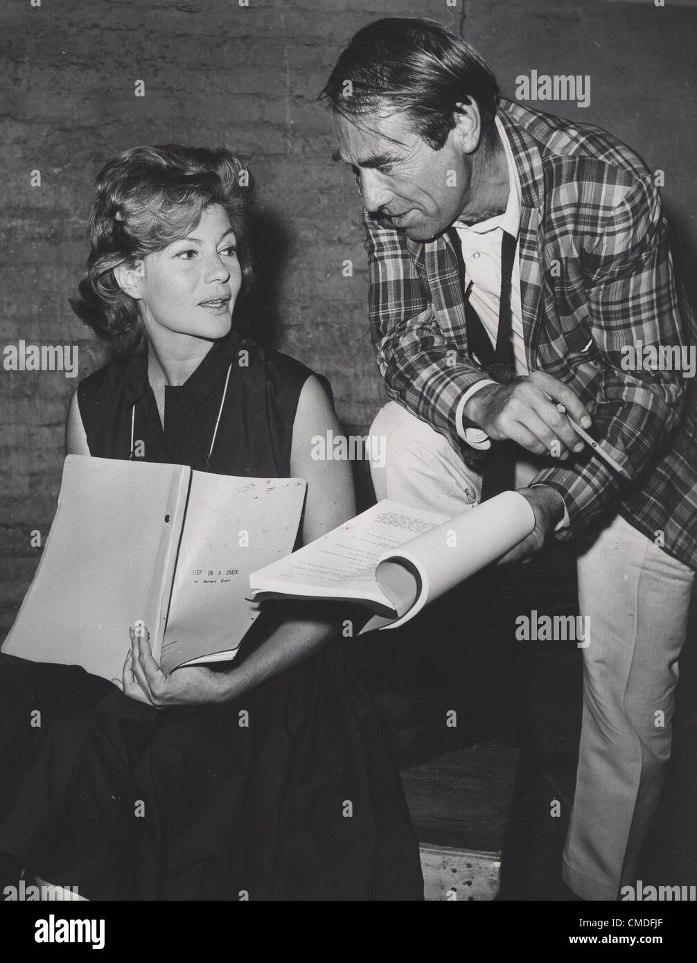 RITA HAYWORTH with Gary Merrill discuss the script as rehearsals get ...