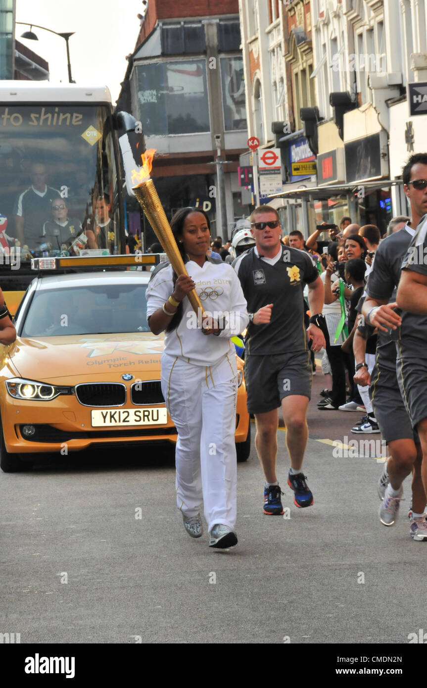 Wood Green, London, UK. 25th July 2012. The Olympic Torch Relay passes ...