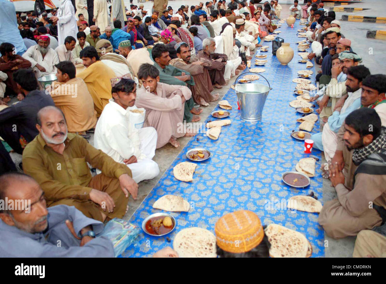 Faithful Muslims sit at Sadabahar Terminal for Iftar during Holy month ...