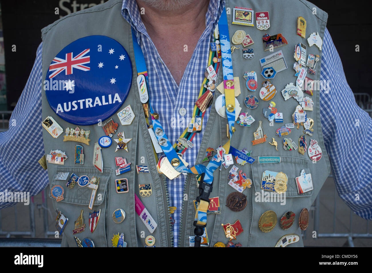 26th July 2012. London UK. A man is wearing a vest covered with Olympic ...